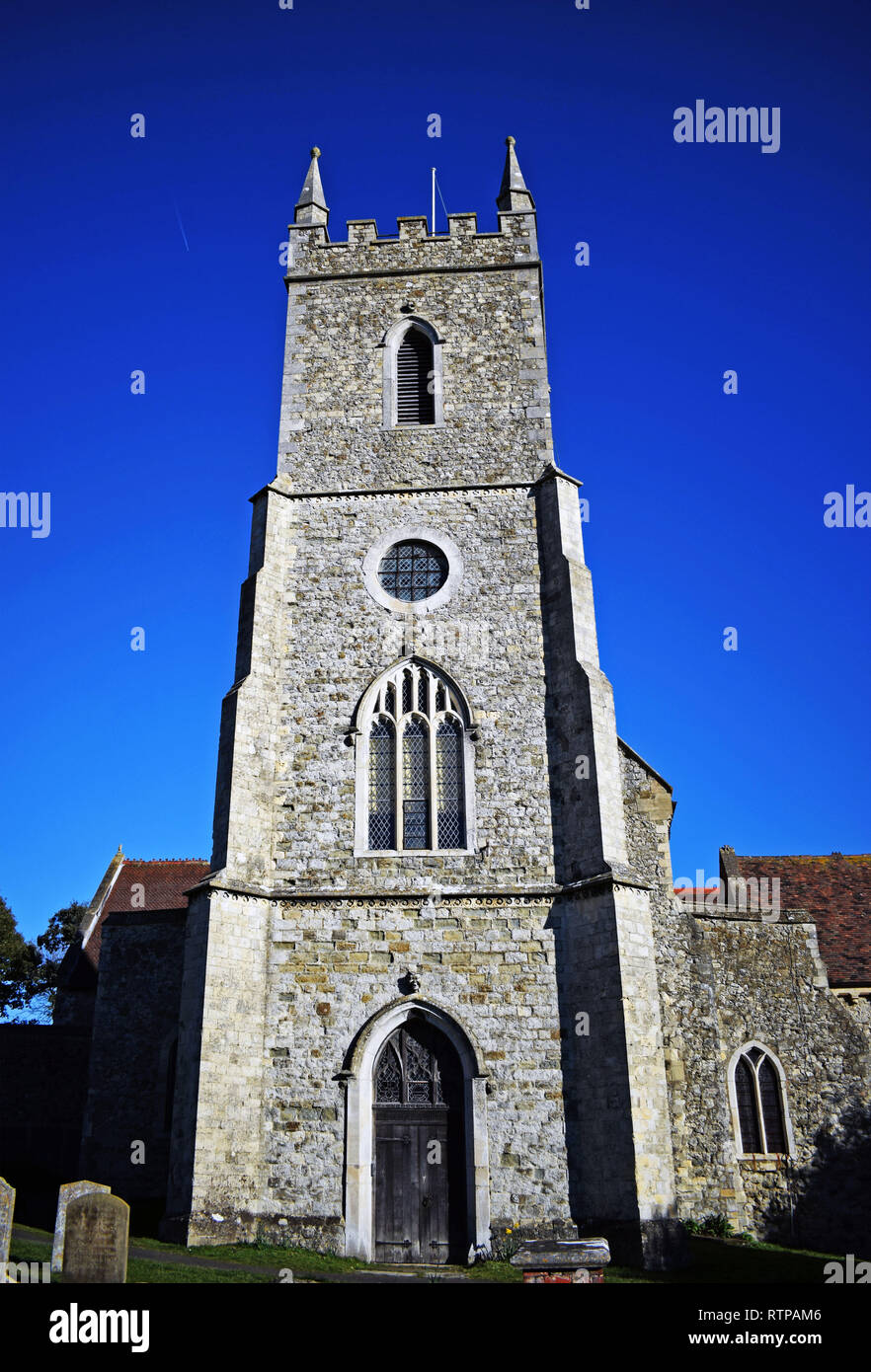 The outside of a Christian Church in the churchyard with a blue sky ...