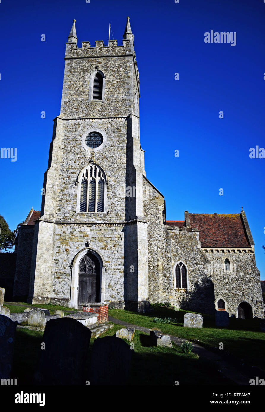 The outside of a Christian Church in the churchyard with a blue sky ...