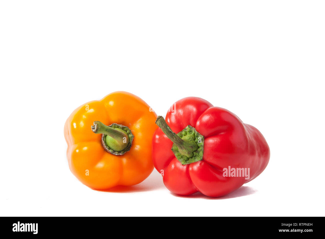 Red and yellow pepper on white background Stock Photo - Alamy