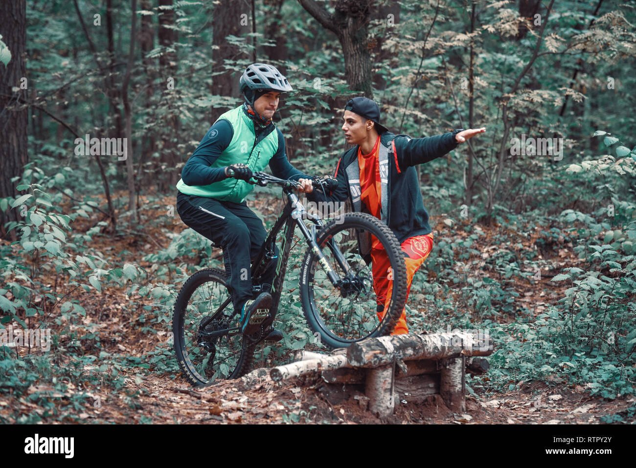 Moscow, Russia - Nov, 2018: MTB teacher helping rider learn to ride ...