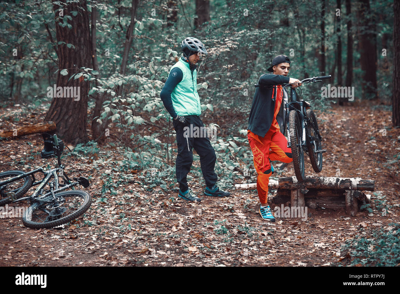 Moscow, Russia - Nov, 2018: MTB teacher helping rider learn to ride ...