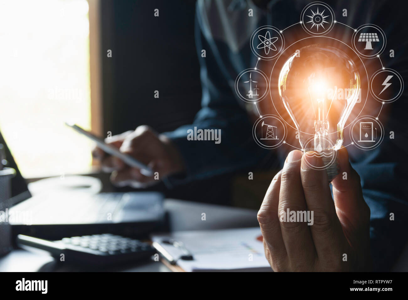 Hand of male holding a light bulb and copy space for accounting, ideas ...