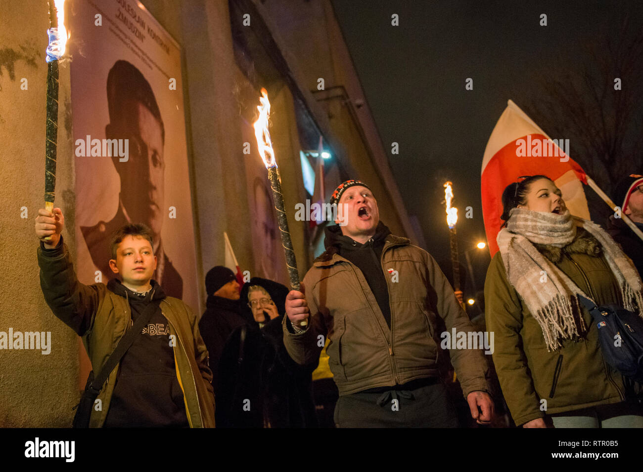 Nationalists are seen holding torches and shouting slogans during the ...