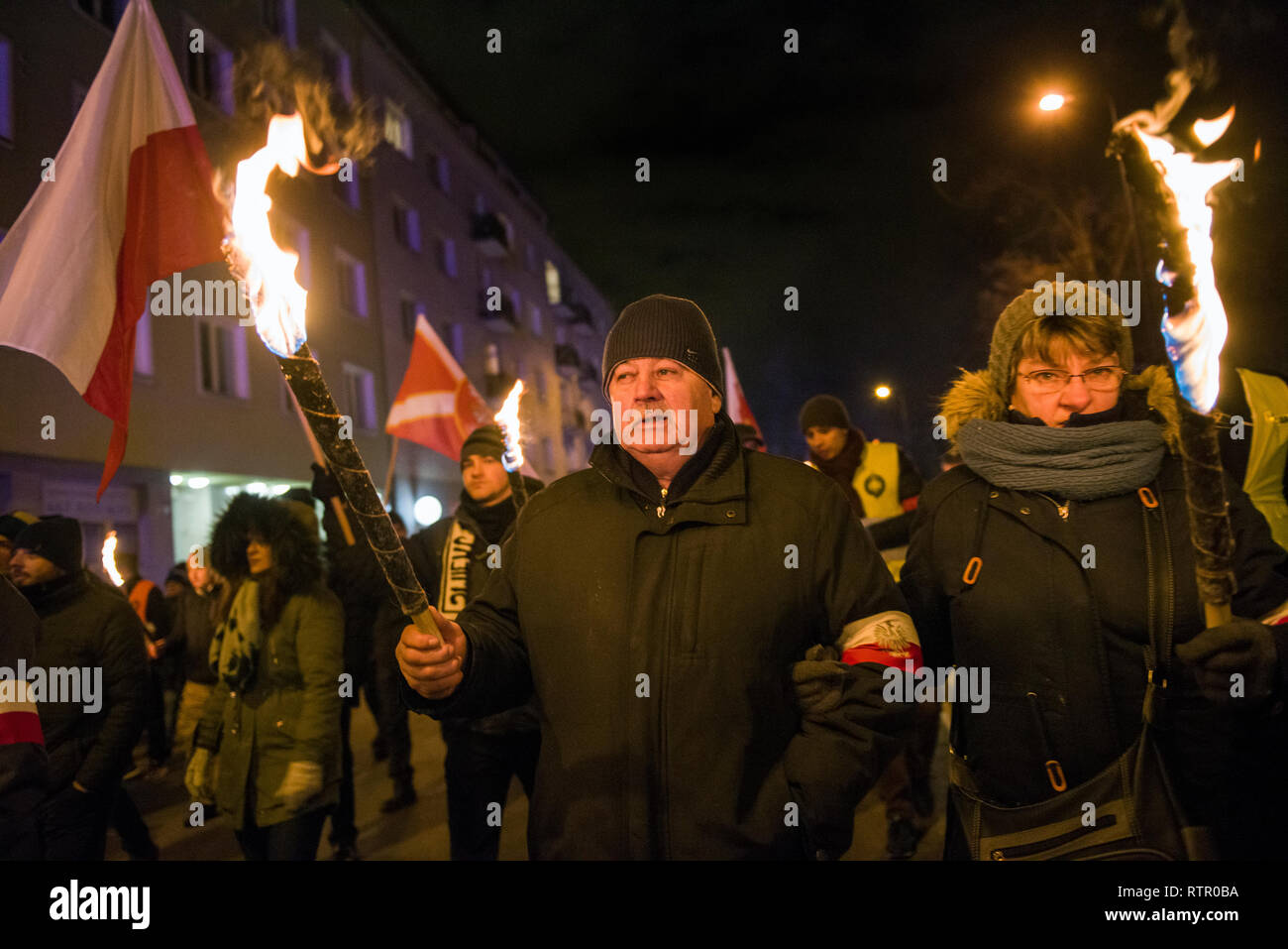 Nationalists seen with torches and Polish flags during the ...