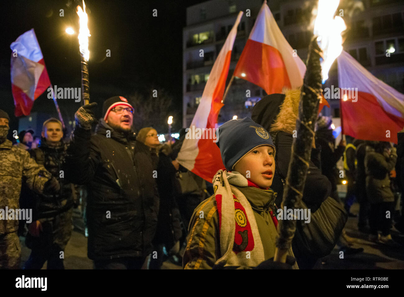 Nationalists seen with torches and Polish flags during the ...