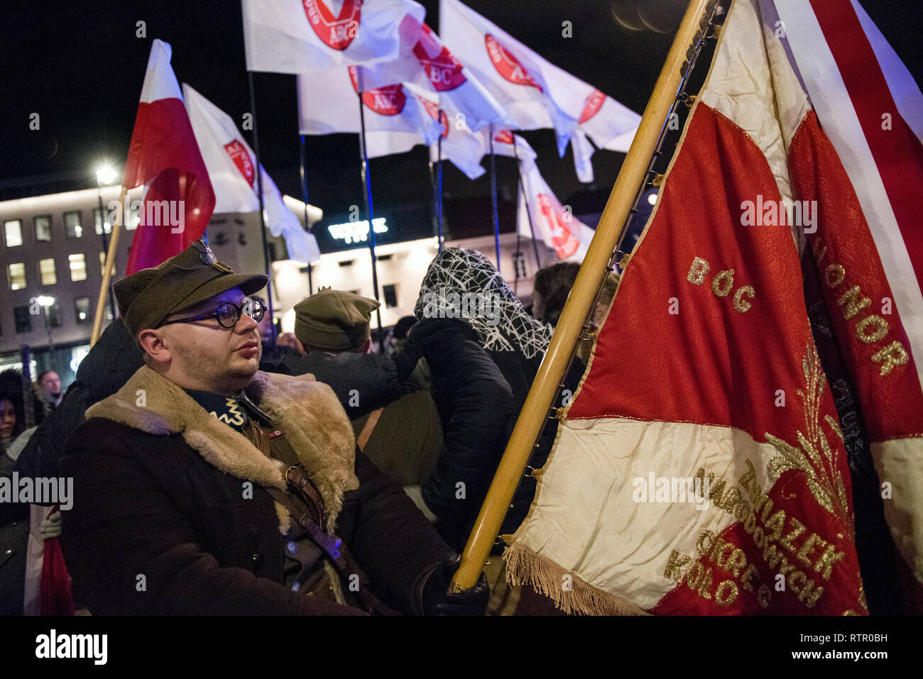 Nationalists seen with flags during the commemorative march. Poles ...