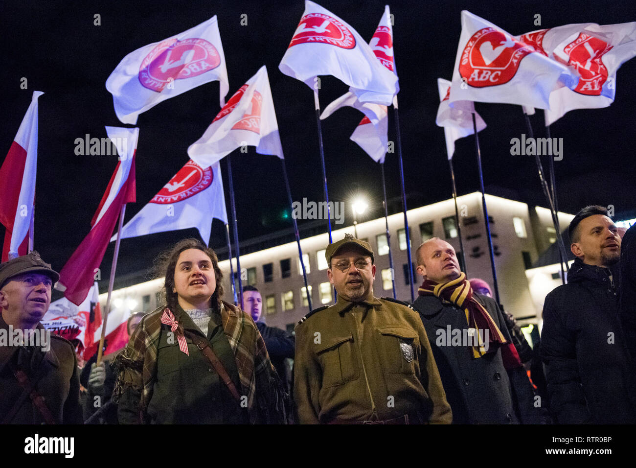 Nationalists seen with flags during the commemorative march. Poles ...