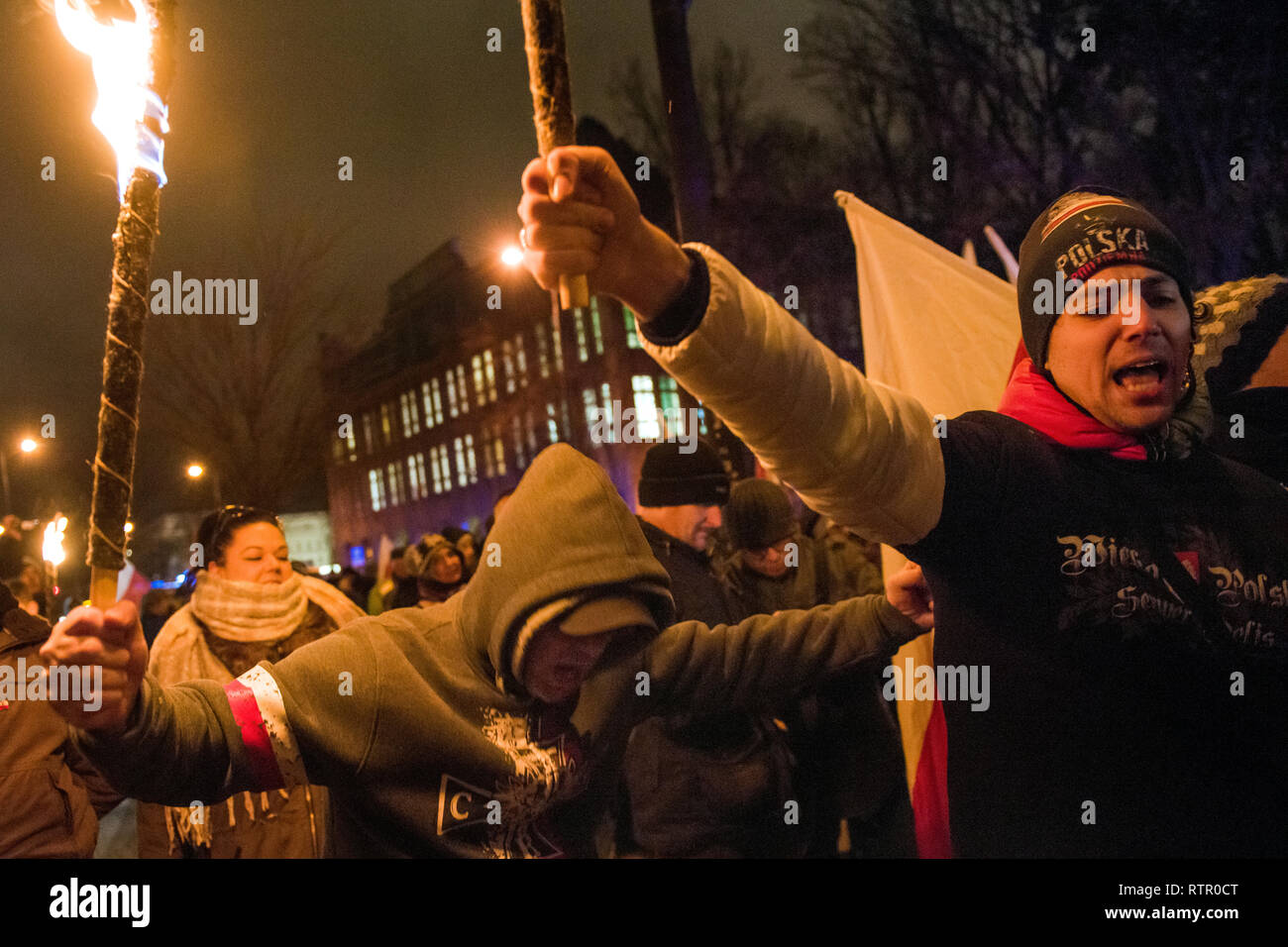 Nationalists are seen holding torches and shouting slogans during the ...
