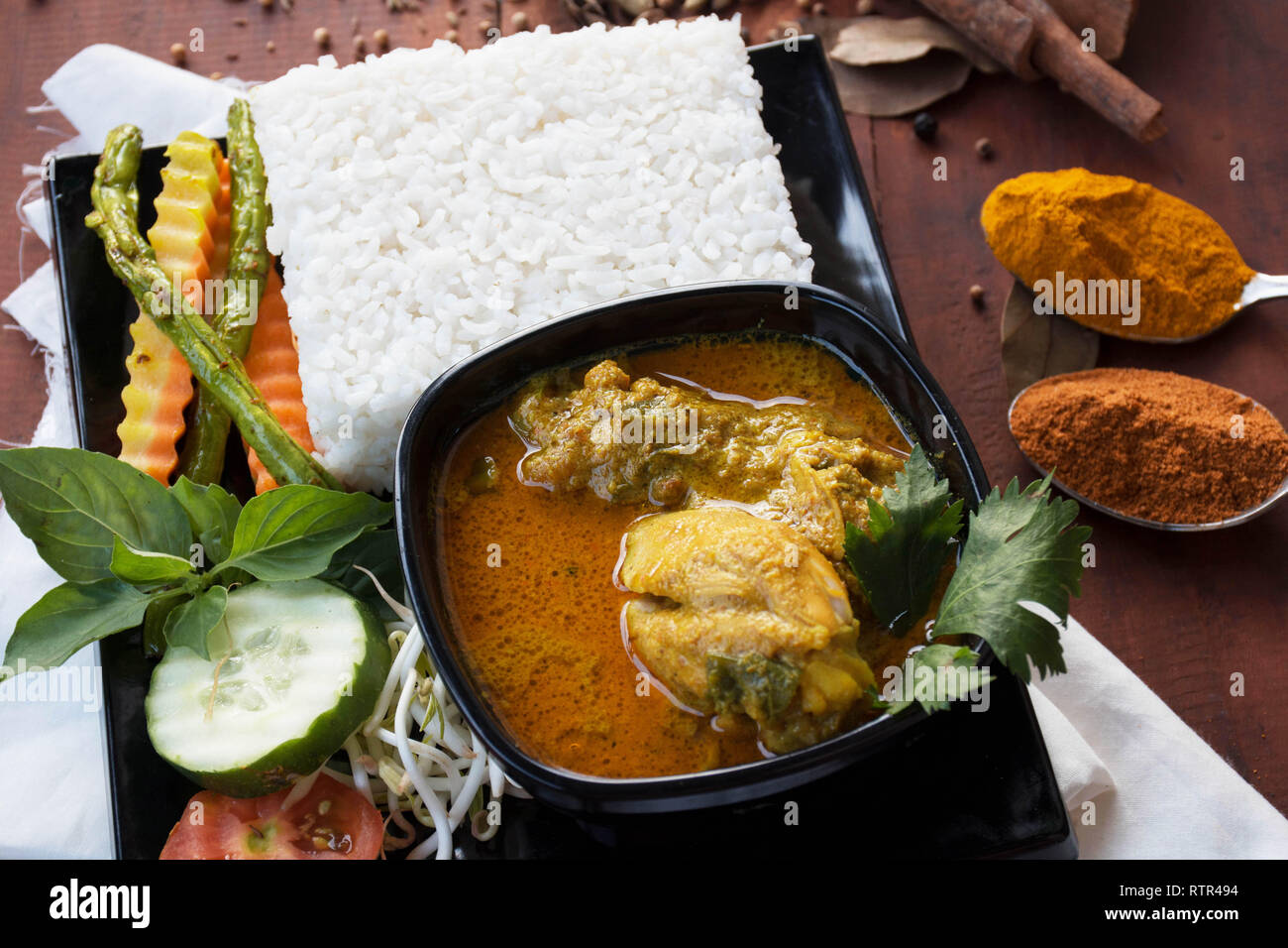 side view of a chicken curry, is a food made from chicken soaked with ...