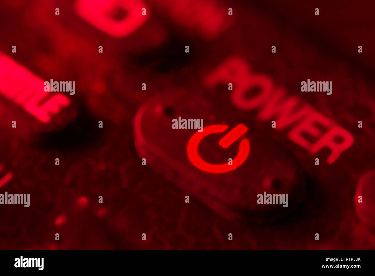 remote red button to turn on. close up Stock Photo - Alamy