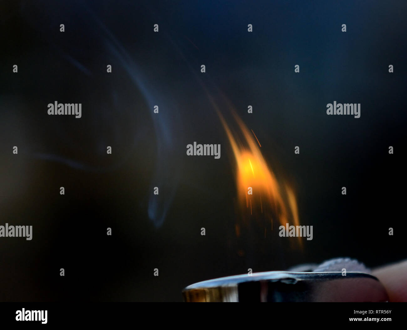 Lighter fire with dark background. Making fire with lighter Stock Photo ...