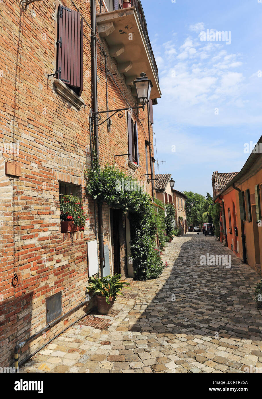 Narrow street in the old town in Italy Stock Photo - Alamy