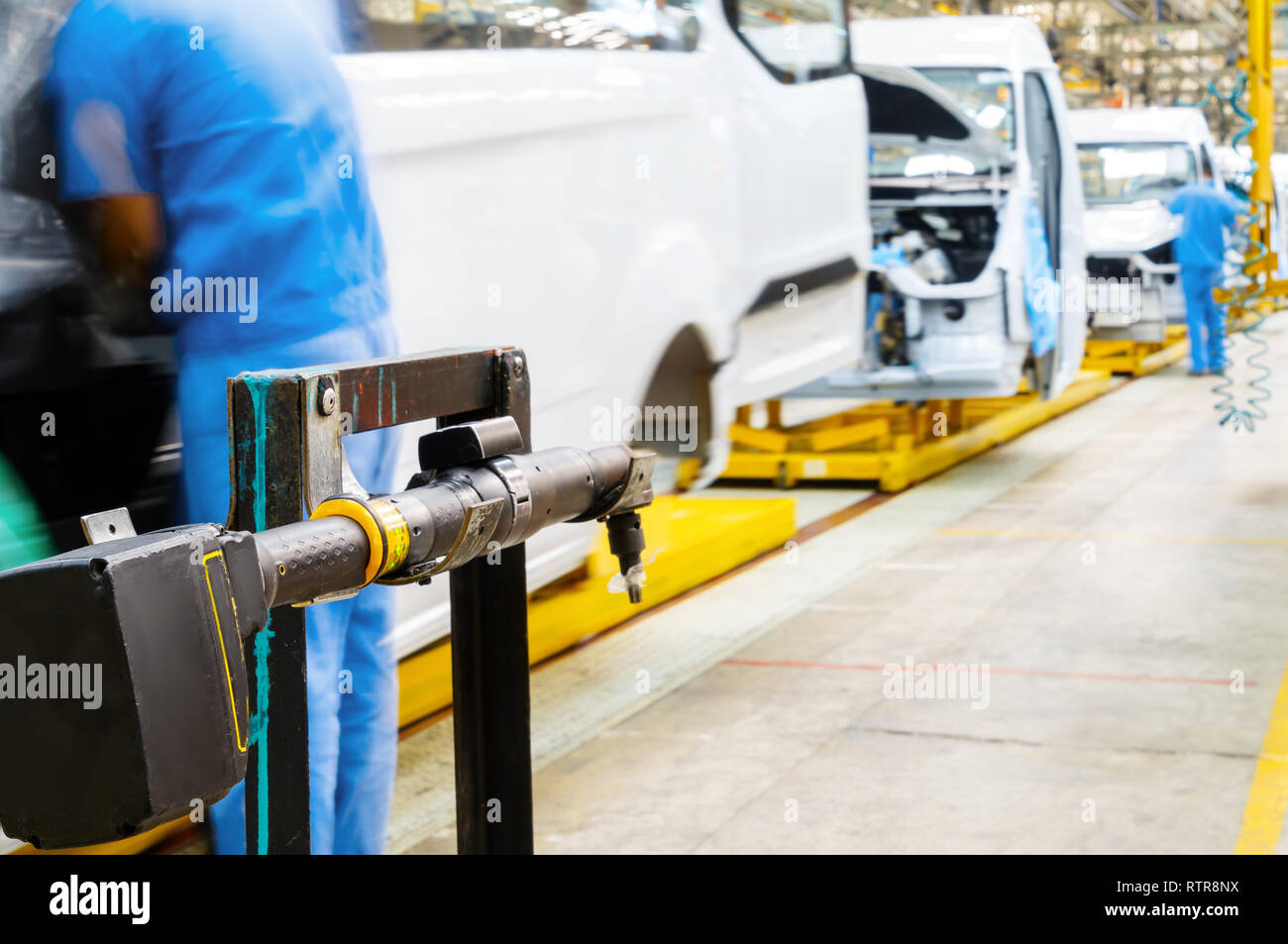 Car production line, skilled workers are working tense Stock Photo - Alamy