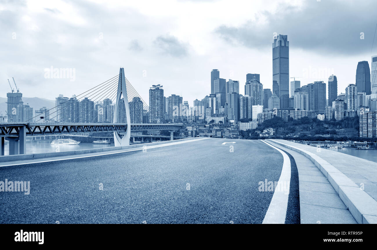Expressway in front of the city skyline, Chongqing, China Stock Photo ...