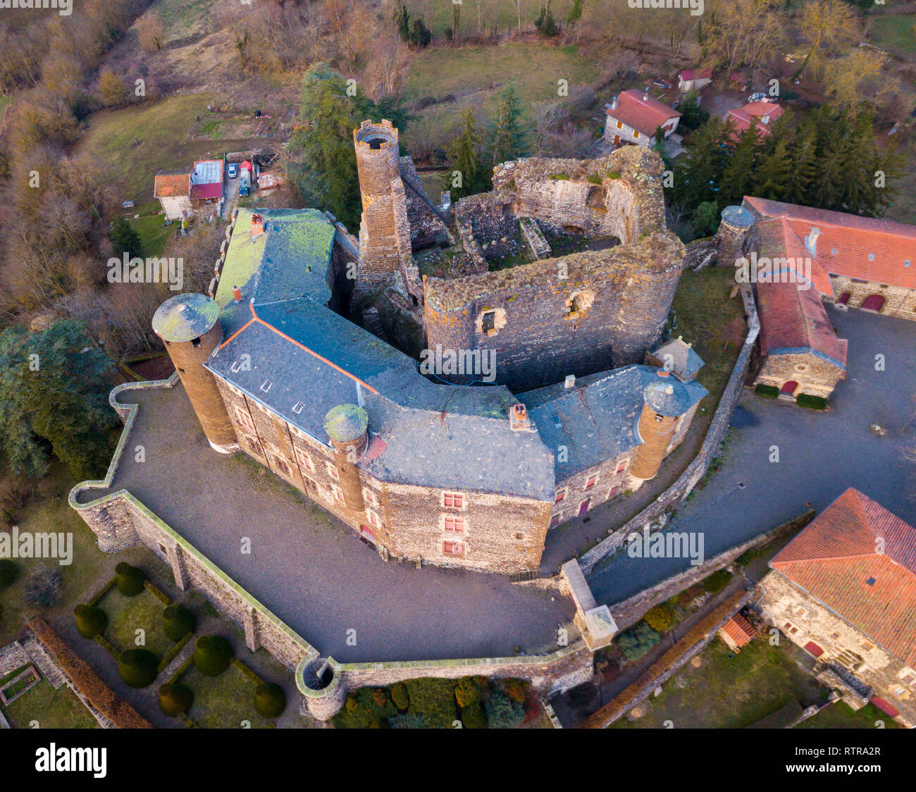 Aerial view of impressive medieval castle of Chateau de Bouzols on hill ...