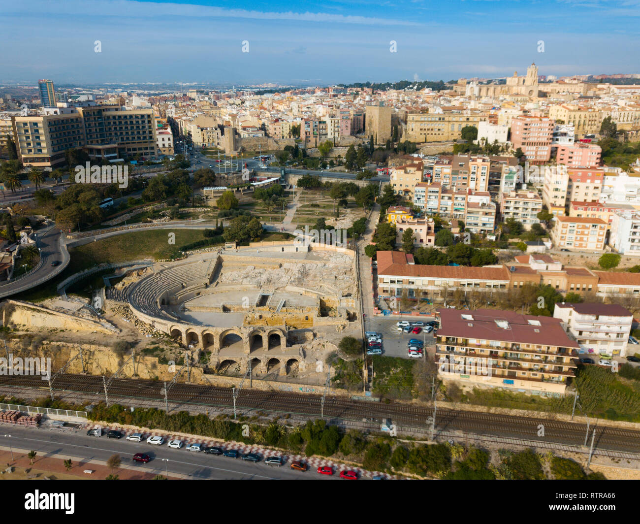 Aerial view of ruins of ancient Roman amphitheater on background with ...
