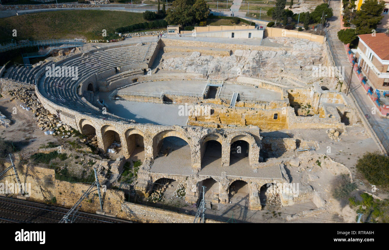 Aerial view of ruins of ancient Roman amphitheater in Spanish city of ...
