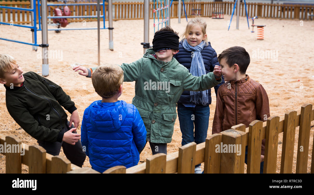 Children play in the blind man's buff Stock Photo - Alamy