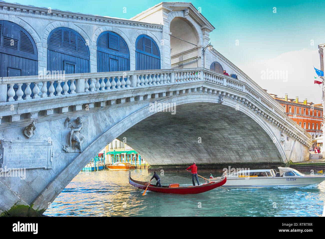 Rialto Bridge is one of the four bridges spanning the Grand Canal Stock ...