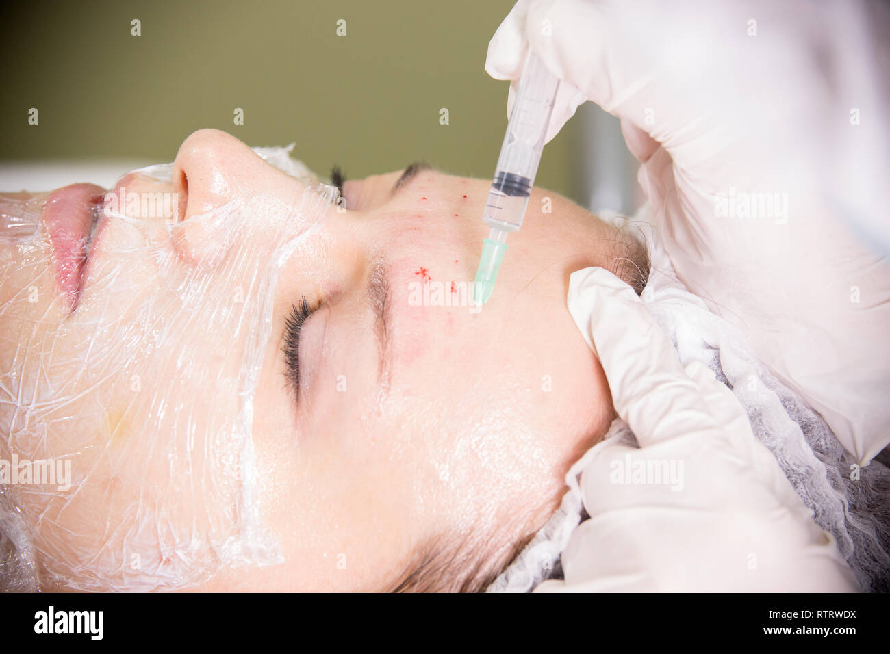 Cosmetologist working with client's face. Cosmetic procedure of ...