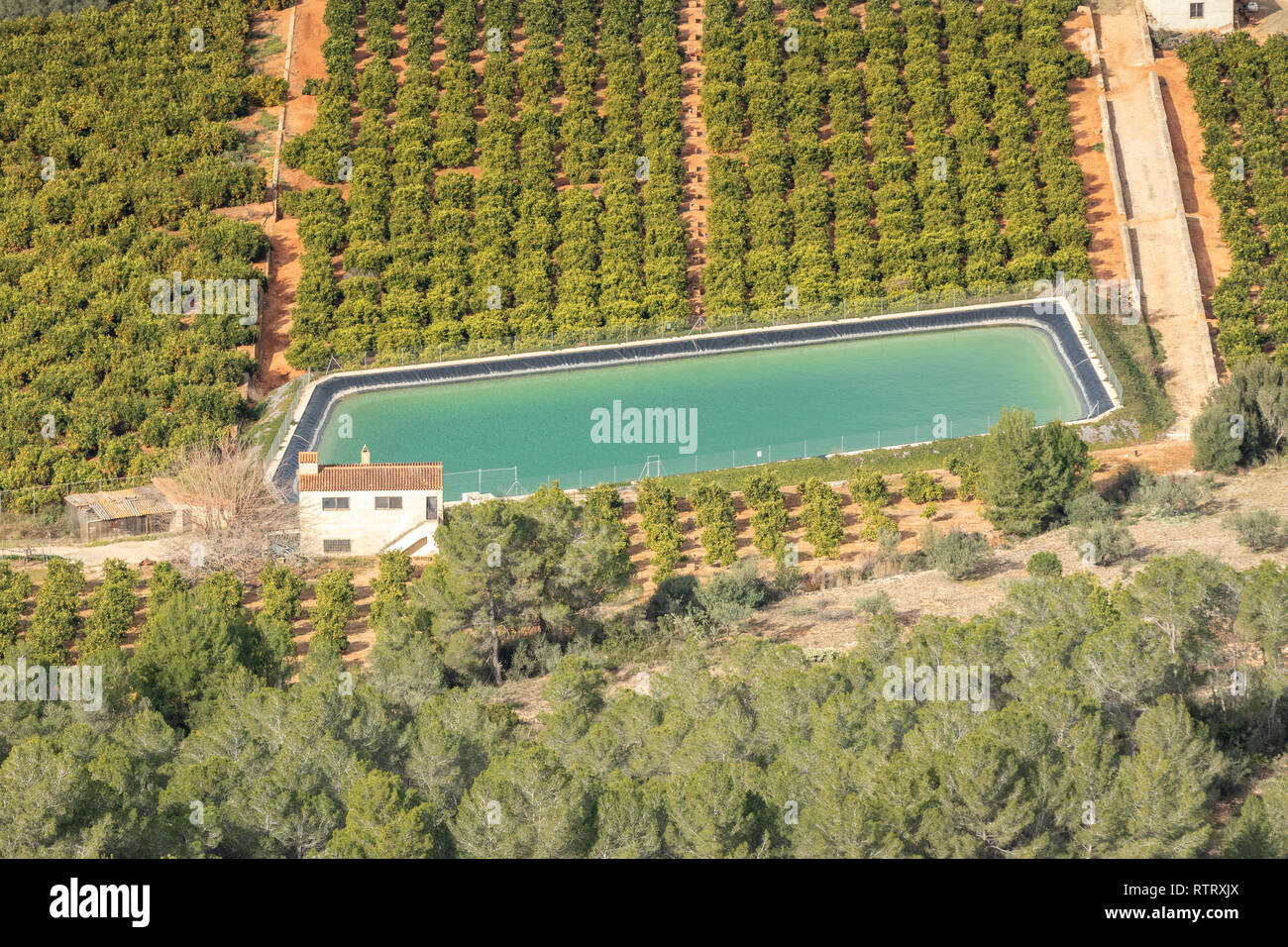 Dehydration pool surrounded by farmland in rural Spanish area Stock ...