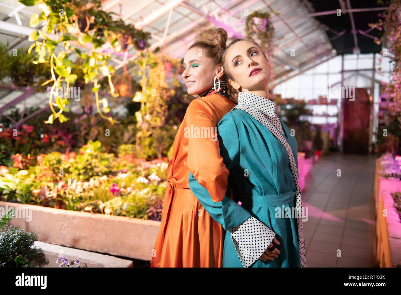 Beautiful good looking women wearing pretty dresses Stock Photo - Alamy