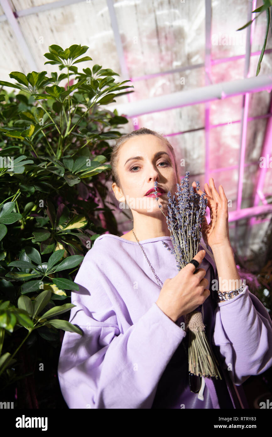 Nice attractive young woman looking at you Stock Photo - Alamy