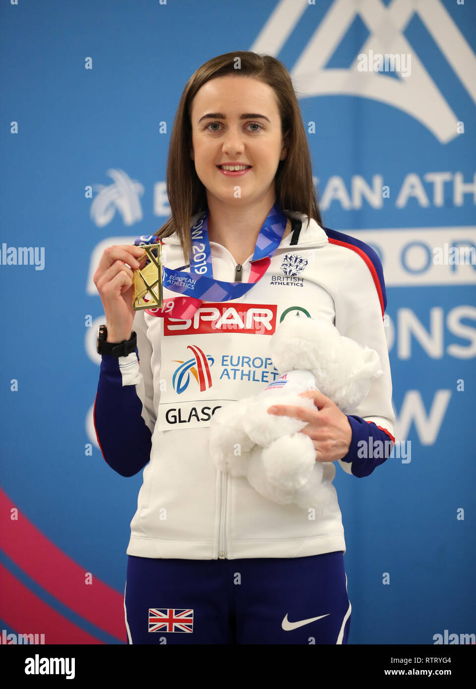 Great Britain's Laura Muir poses with her gold medal after winning the ...