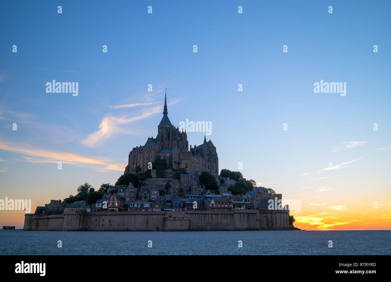 Amazing view of Mont Saint-Michel castle at sunset time. Normandy Stock ...