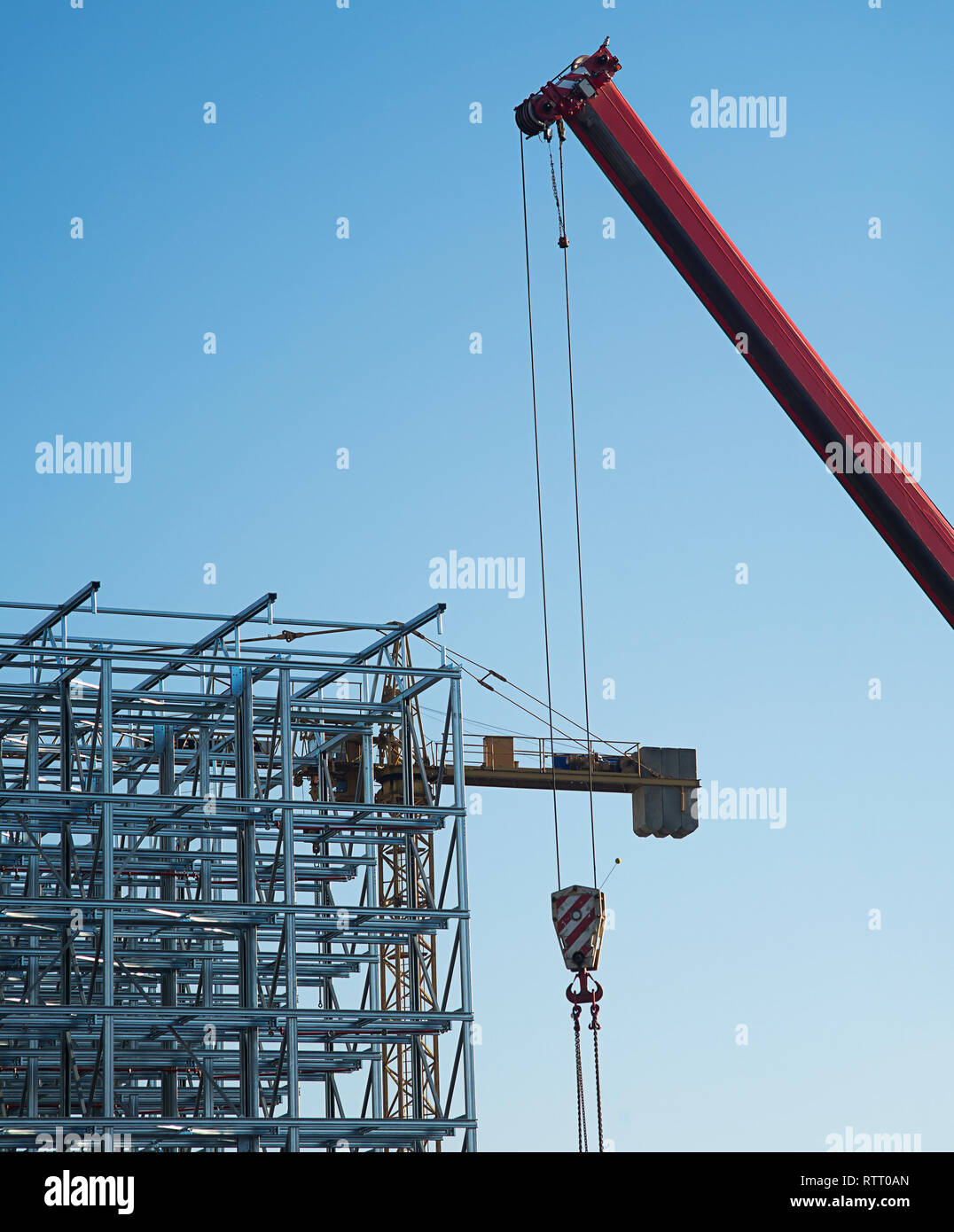 Construction cranes with a metal structure frame being built Stock ...