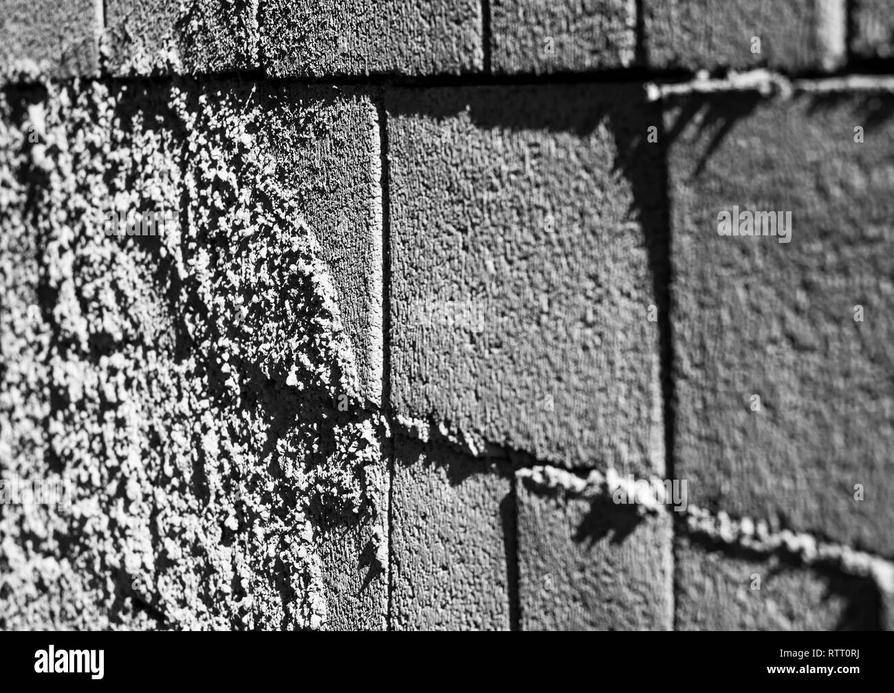 Unfinished concrete brick wall from a side view Stock Photo - Alamy