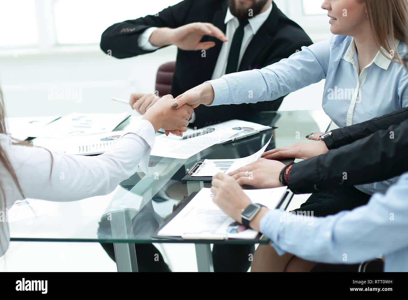 colleagues confirming the job with a handshake Stock Photo - Alamy