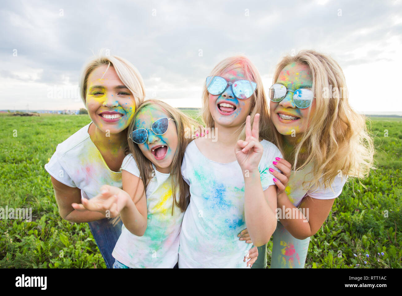 Friendship, holidays, color concept - friends smiling and having fun in ...