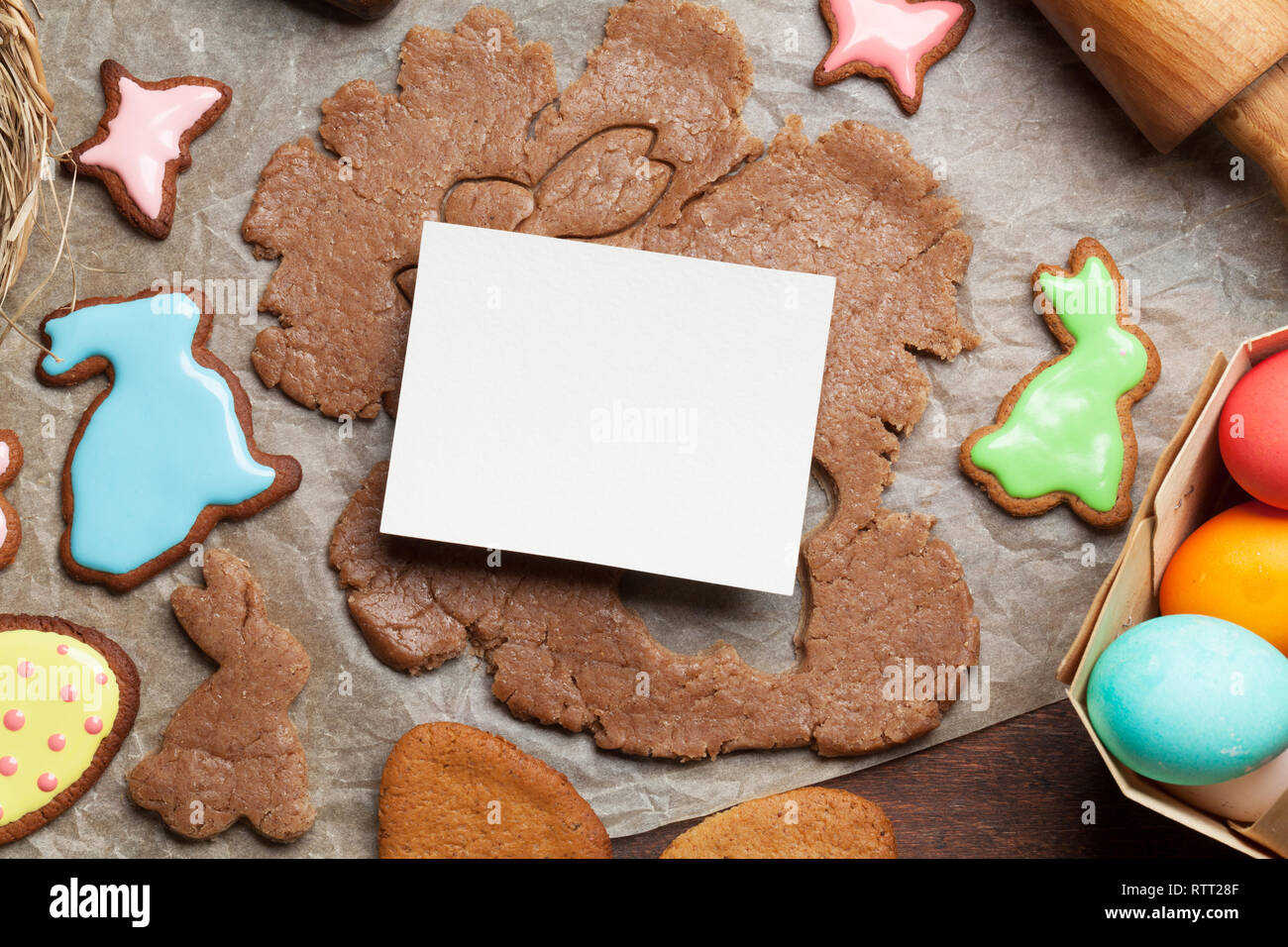 Easter greeting card with cooking gingerbread cookies and colorful eggs ...