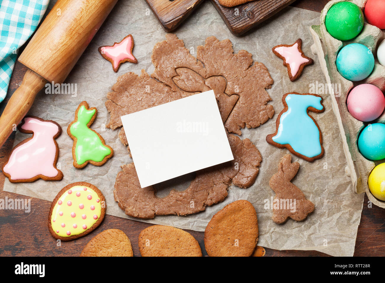 Easter greeting card with cooking gingerbread cookies and colorful eggs ...