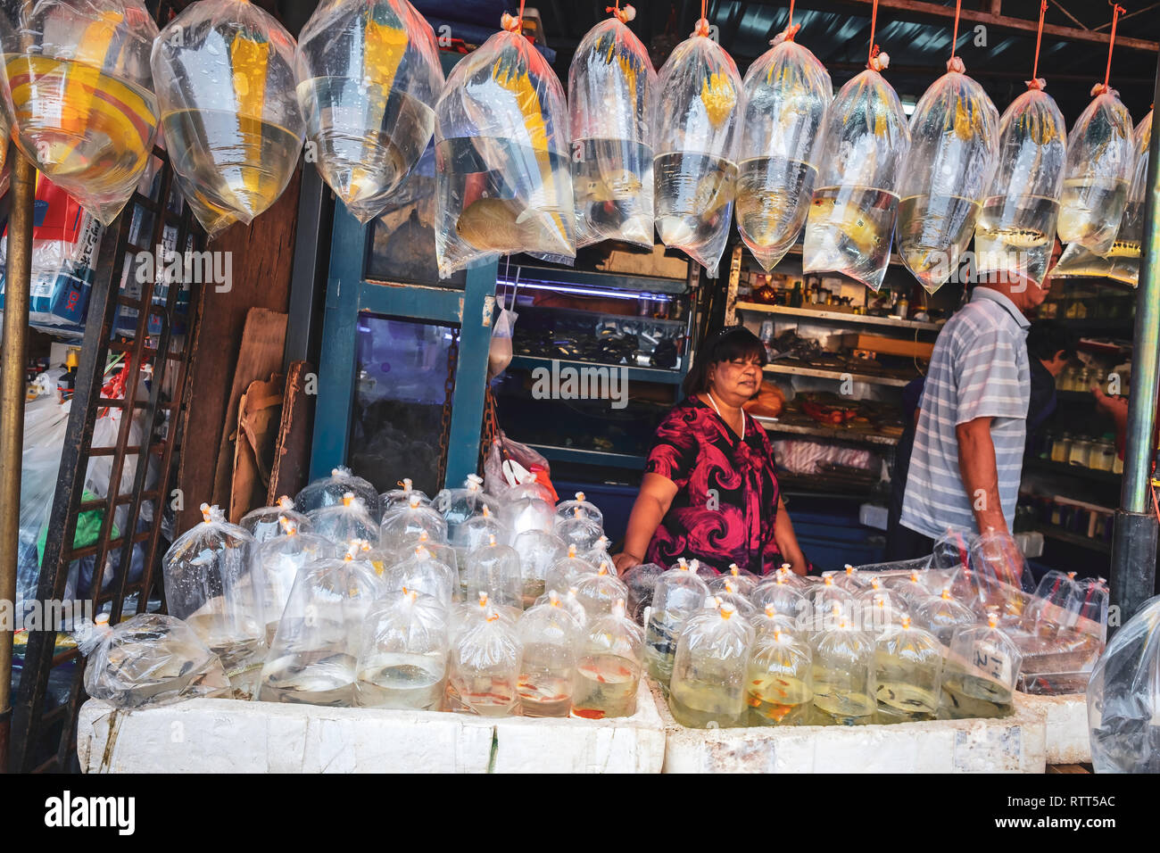 KUALA LUMPUR / MALAYSIA / JUNE 2014: Selling fishes in Pudu street ...