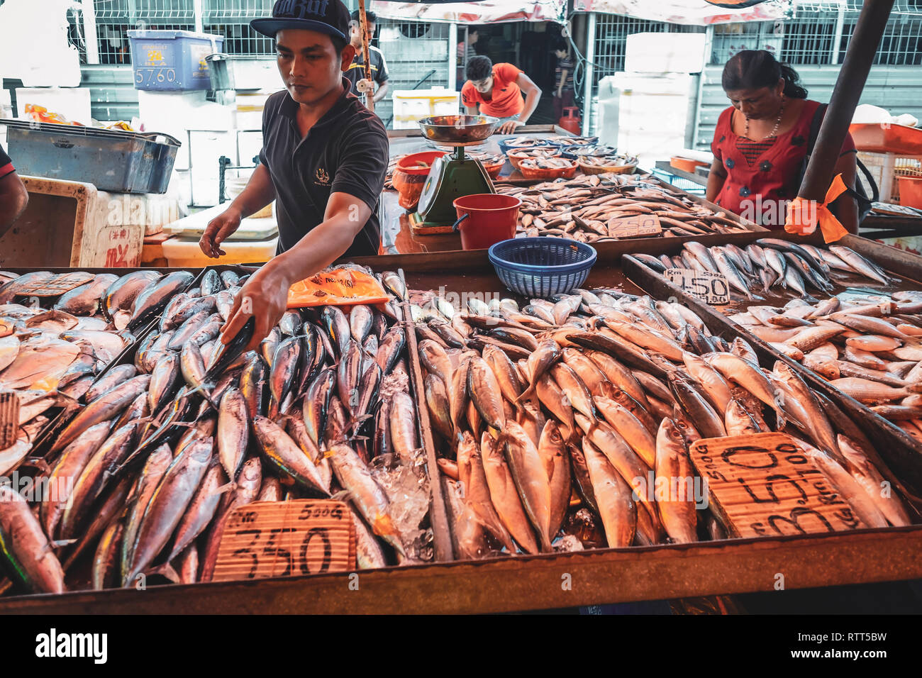 KUALA LUMPUR / MALAYSIA / JUNE 2014: Selling seafood in the Pudu street ...