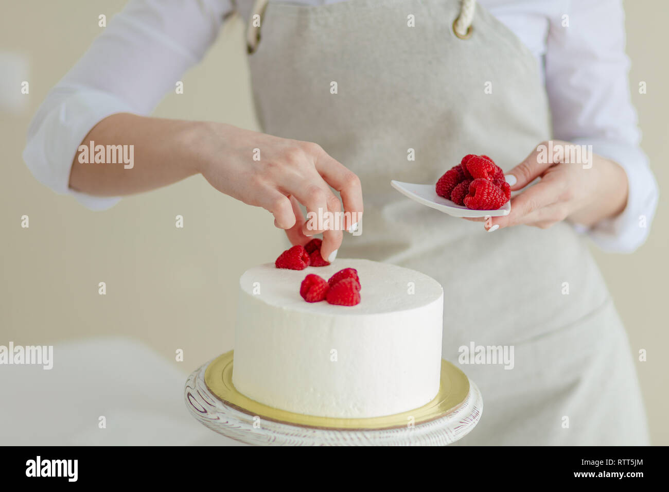 woman creating a beautiful cake. close up cropped photo, professional ...