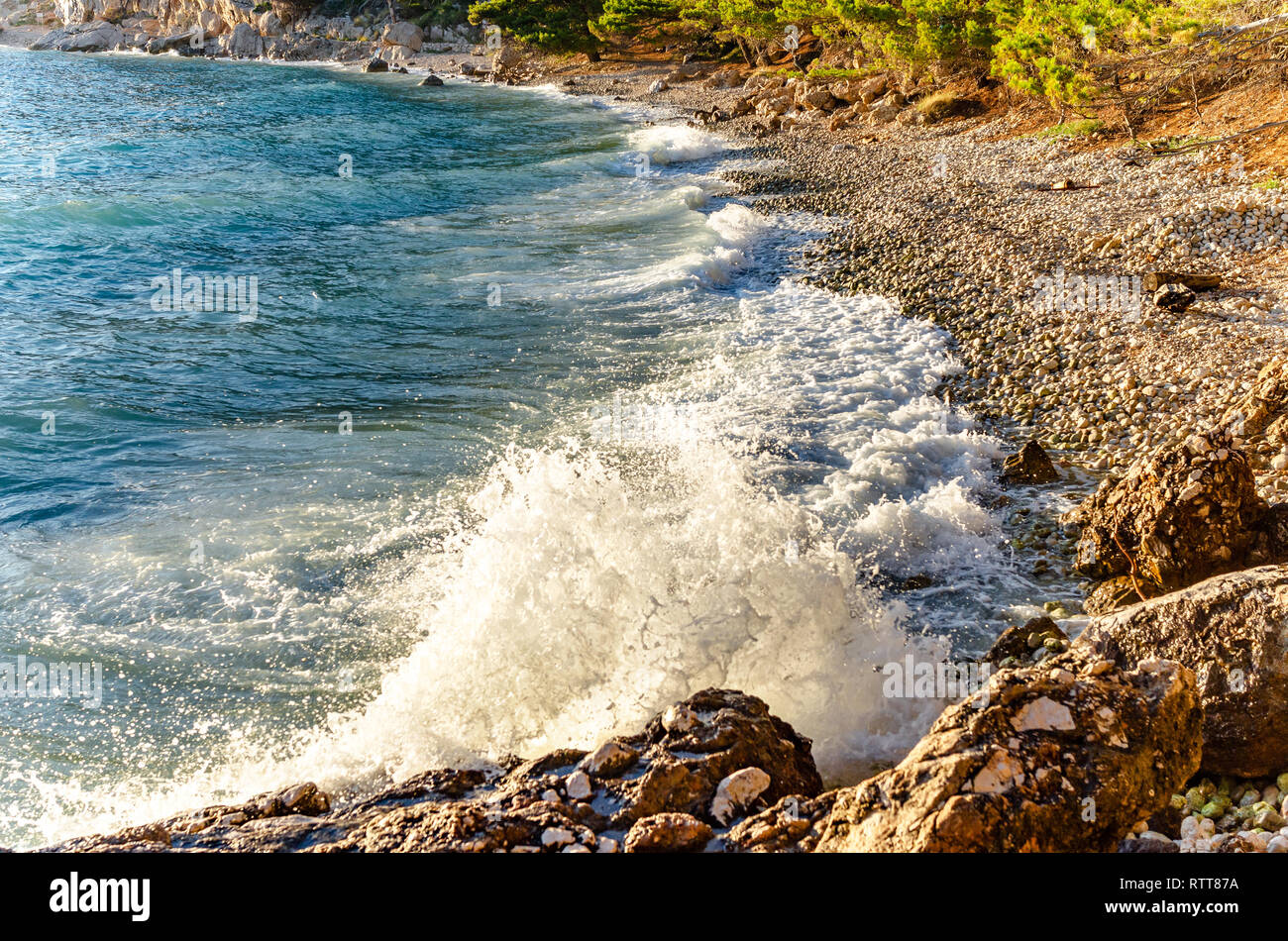 Waves beat on the coastal stones Stock Photo - Alamy