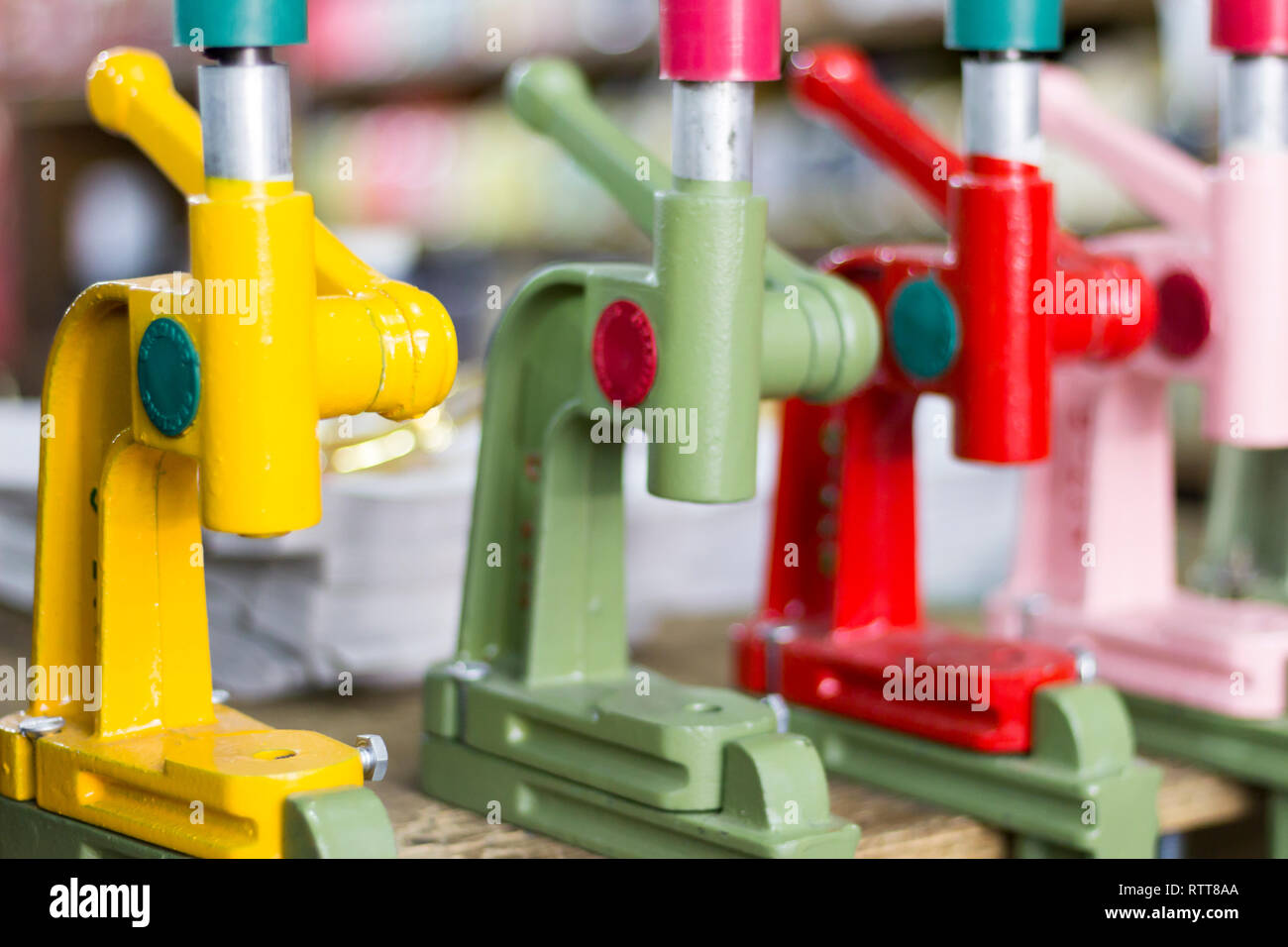 Detail of manual hand press button machines with blurred background ...