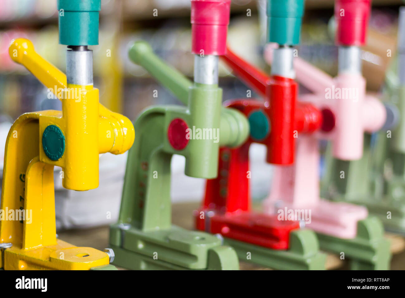 Detail of manual hand press button machines with blurred background ...