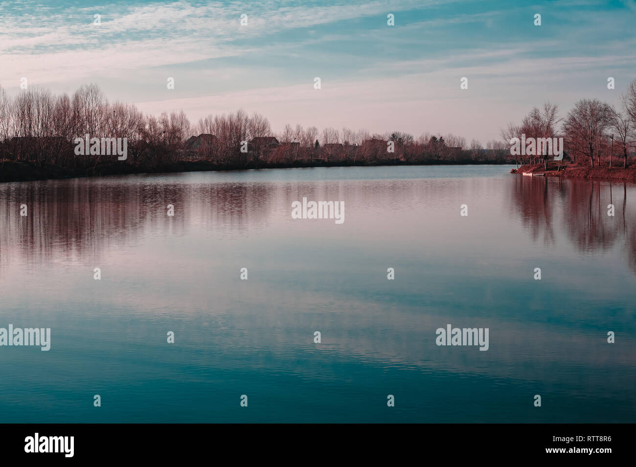 Sunset over water Stock Photo - Alamy