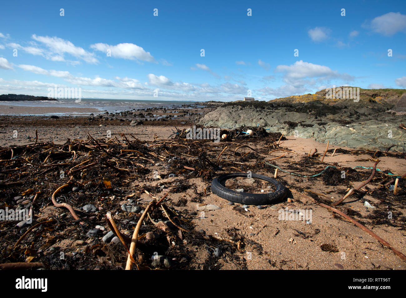A car tyre and other debris washed up on the shores of Ruby Bay in Elie ...