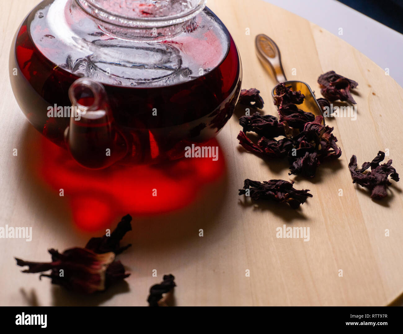 Hot red egyptian hibiscus karkade tea in the teapot Stock Photo - Alamy