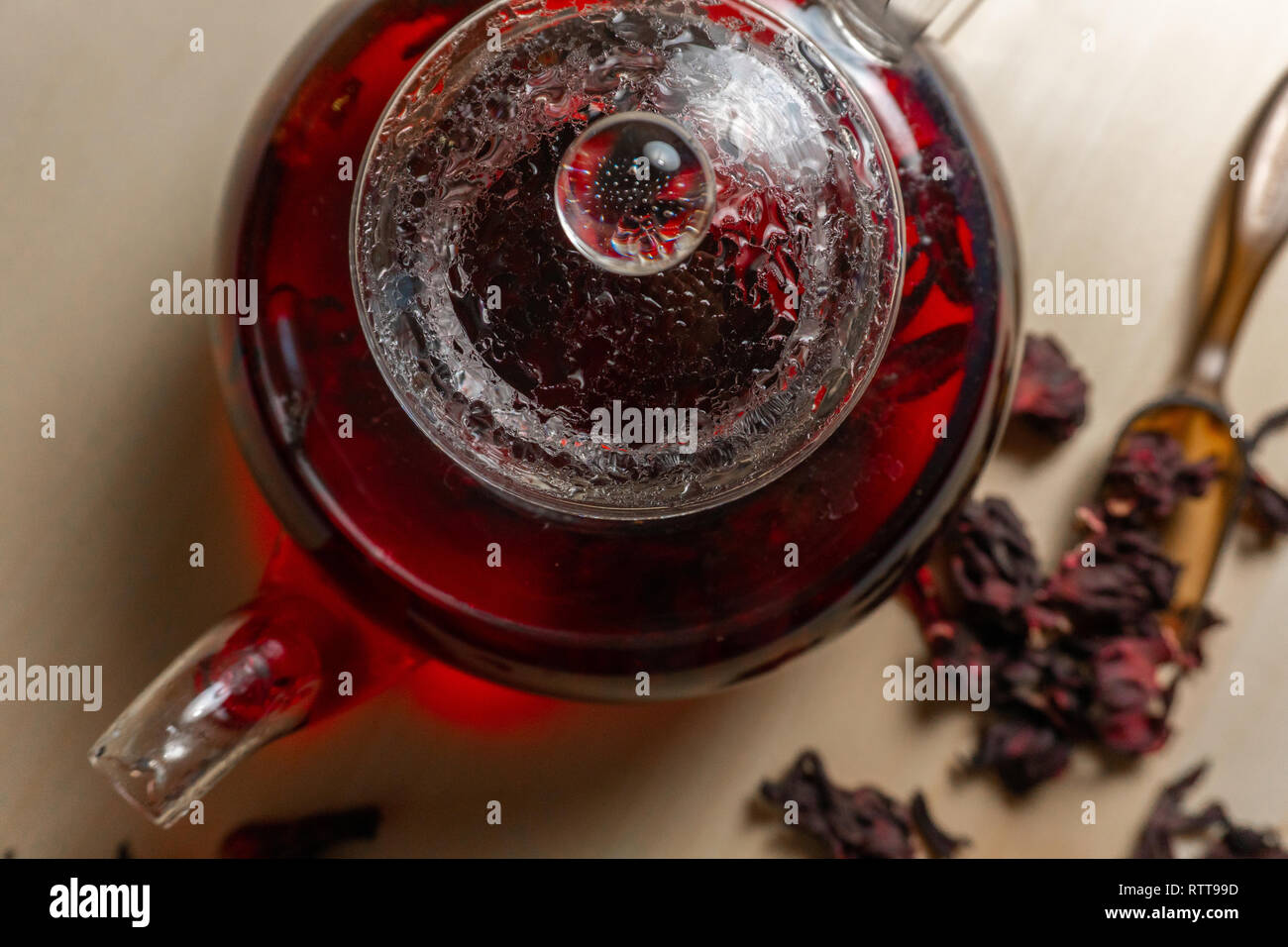 Red egyptian karkade tea in teapot. Hibiscus tea, top view Stock Photo ...