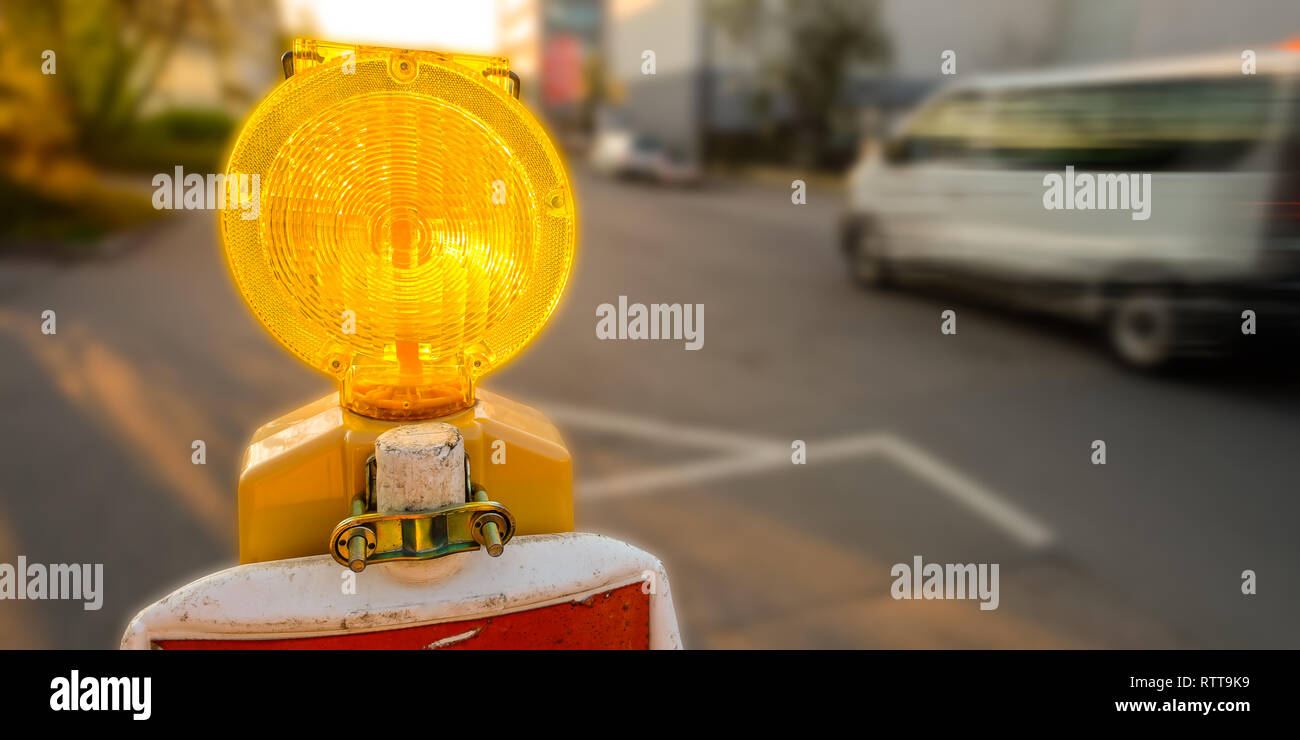 Warning light construction site with transporter in motion blur Stock ...