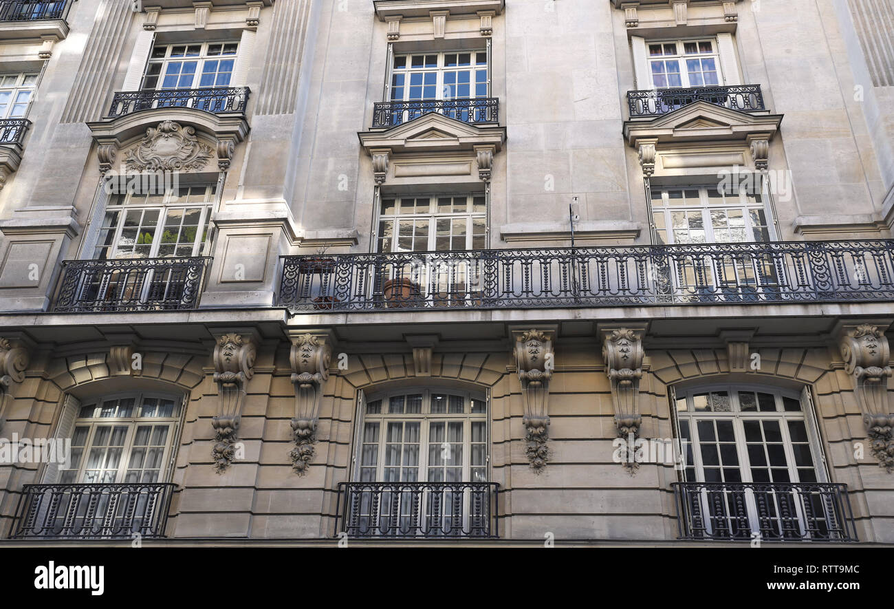 Traditional French house with typical balconies and windows. Paris ...