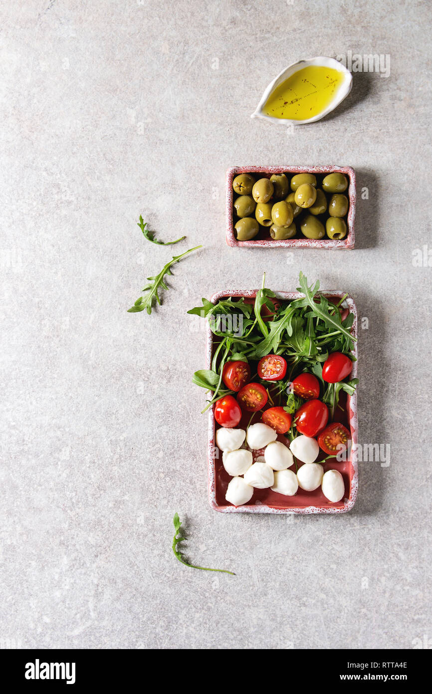 Mozzarella tomatoes olives antipasto Stock Photo - Alamy