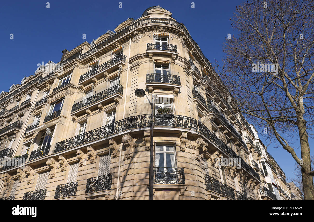 Traditional French house with typical balconies and windows. Paris ...