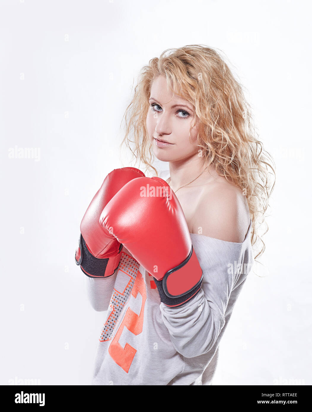 smiling young woman in Boxing gloves .isolated on white Stock Photo - Alamy